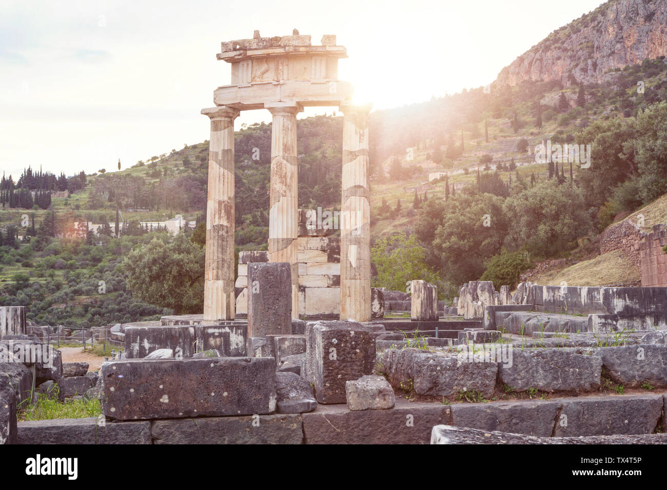 Greece, Delphi, tholos in the sanctuary of Athena Pronaia at sunset ...