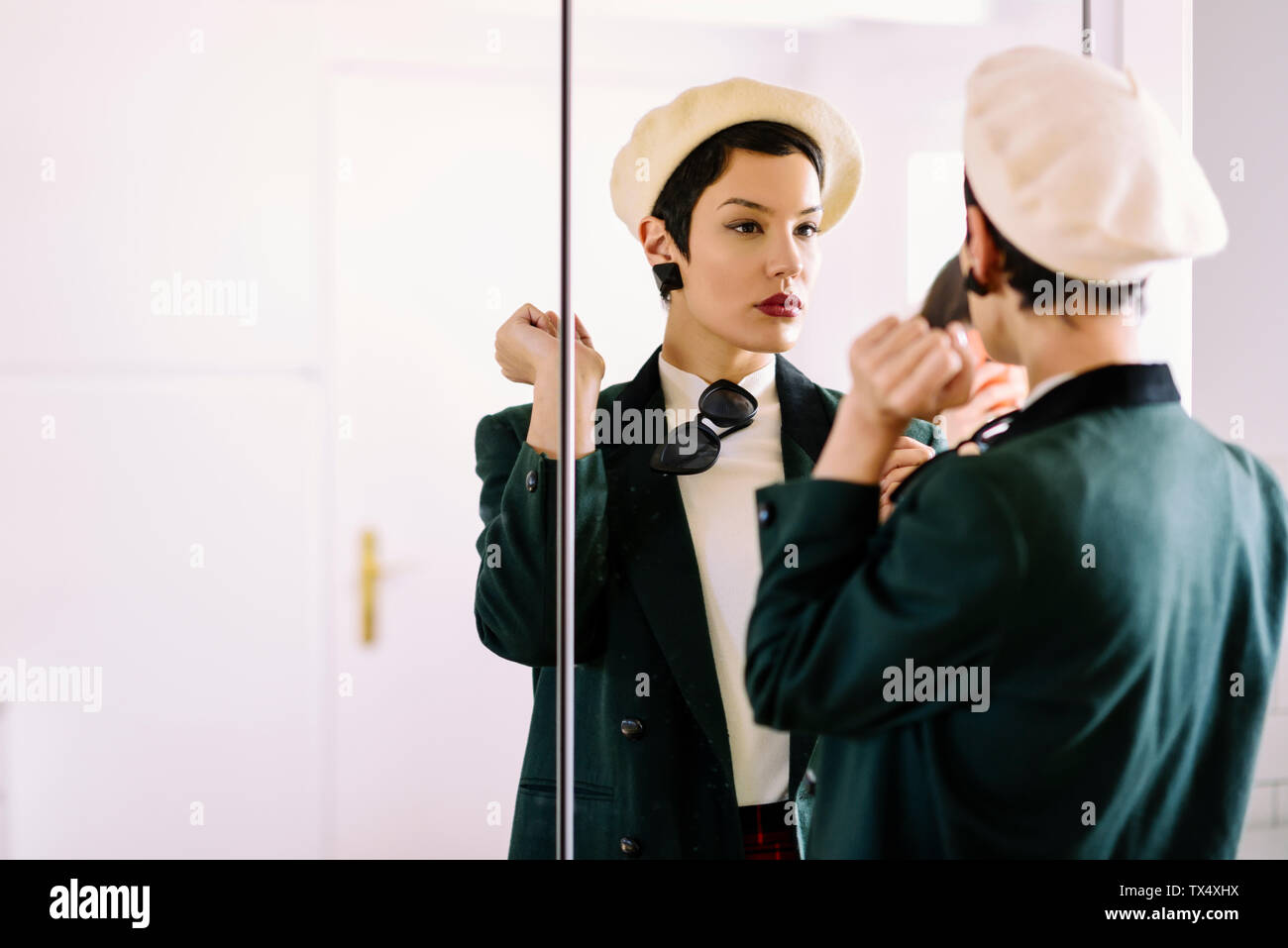 Checking in mirror hi-res stock photography and images - Alamy