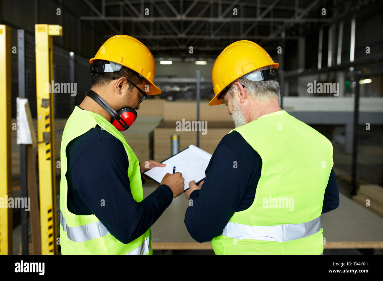 Warehouse worker signing document hi-res stock photography and images ...