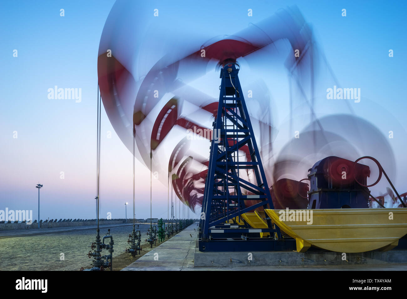 working oil-rig in oilfield in clear sky Stock Photo - Alamy