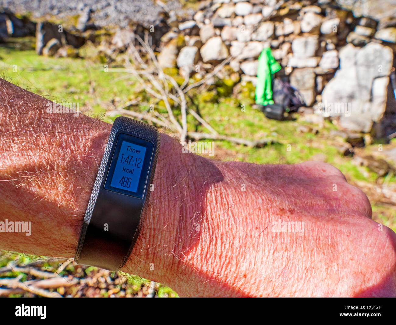 Smartwatch with data on wrist of a hiker Stock Photo - Alamy