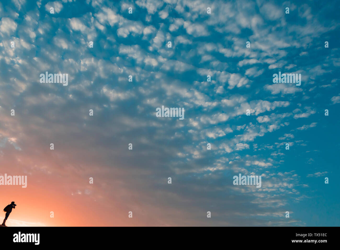 Silhouette man taking pictures sunset hi-res stock photography and ...