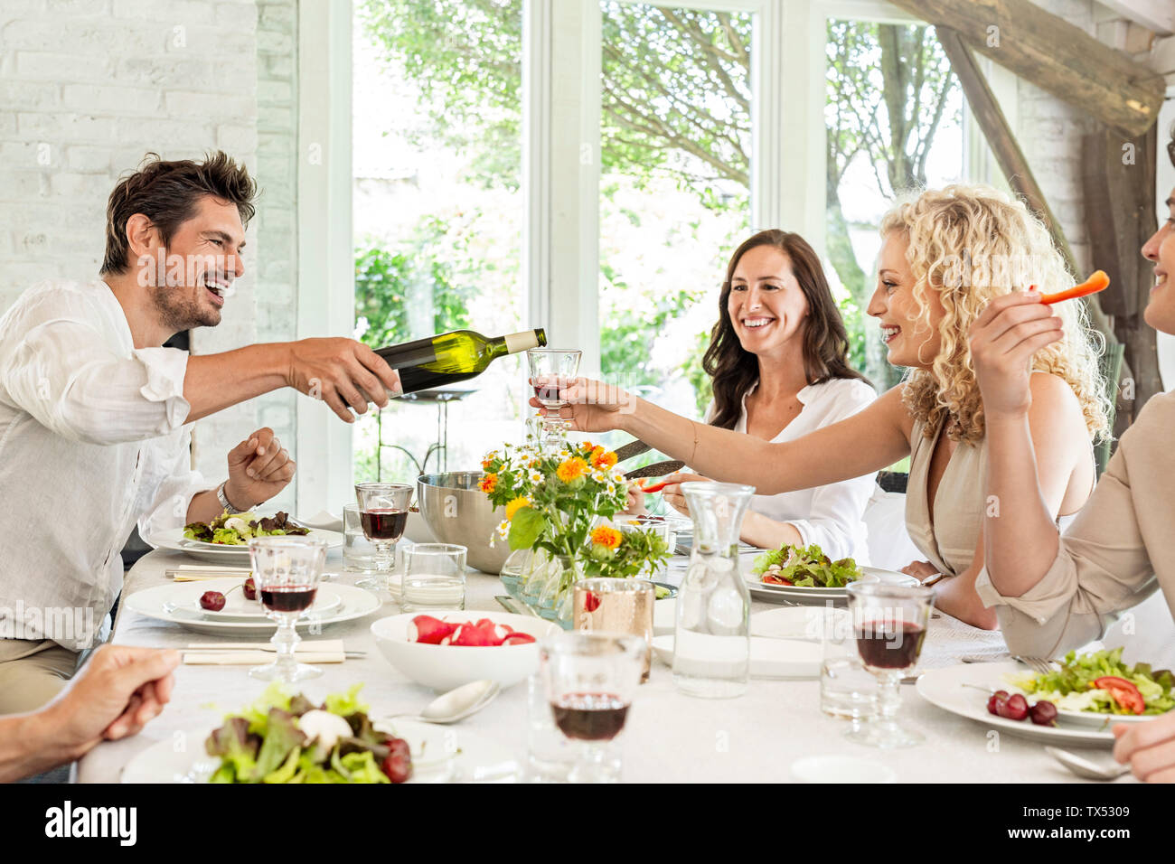 Hapüpy family celebrating together, drinking wine Stock Photo - Alamy