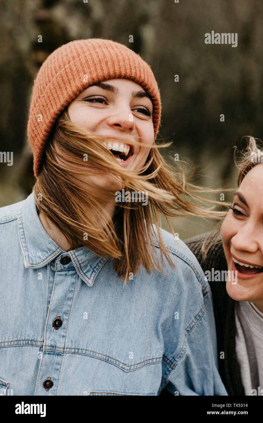 UK, Scotland, two laughing young women outdoors Stock Photo - Alamy
