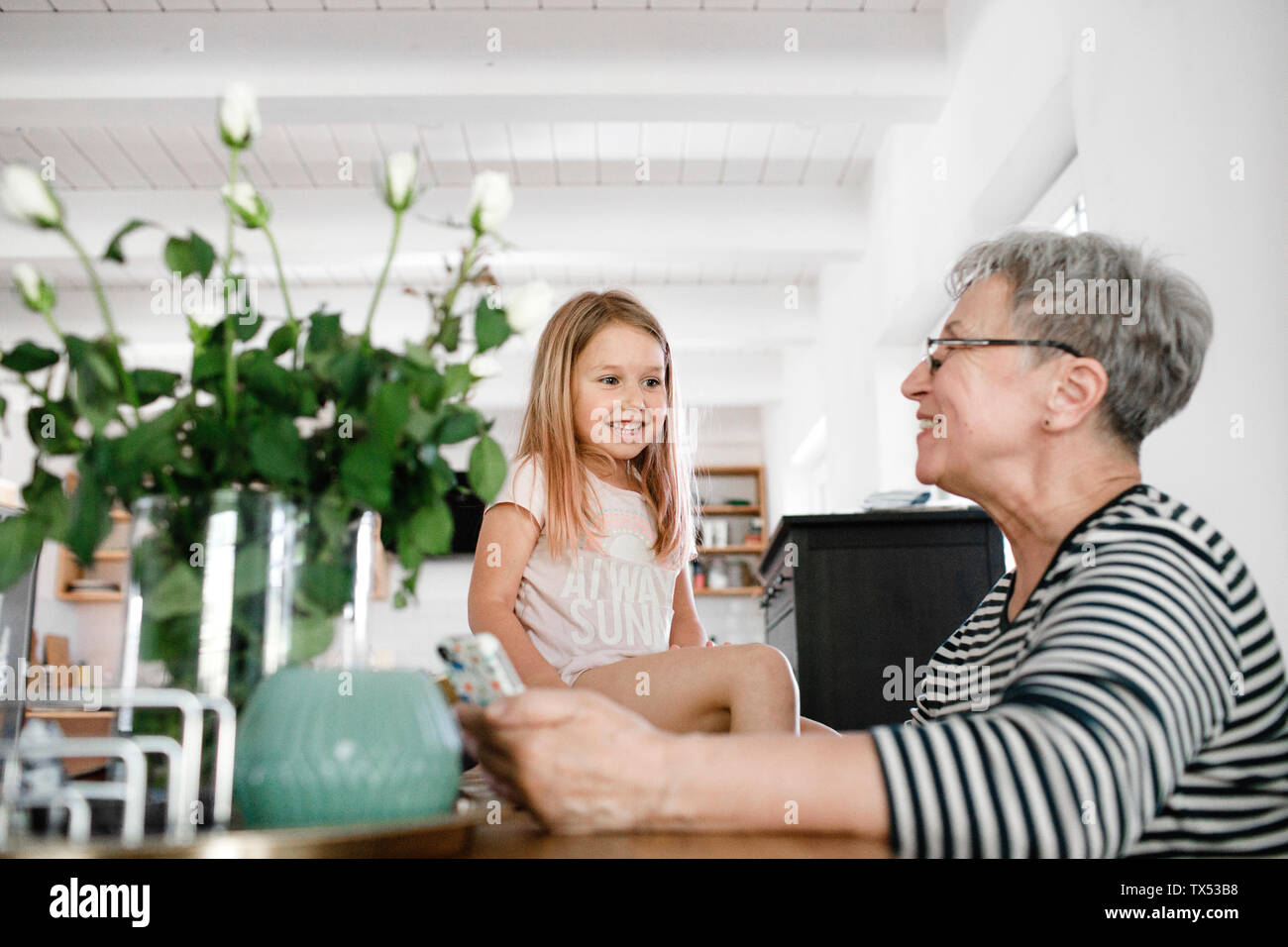 Granddaughter holding flowers hi-res stock photography and images - Alamy