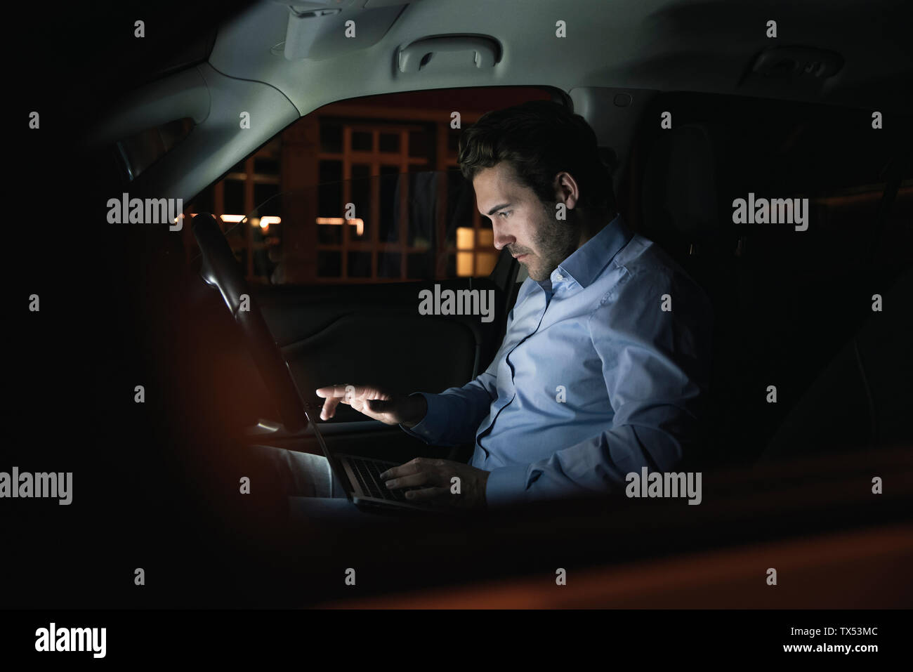 Laptop on car in hi-res stock photography and images - Alamy