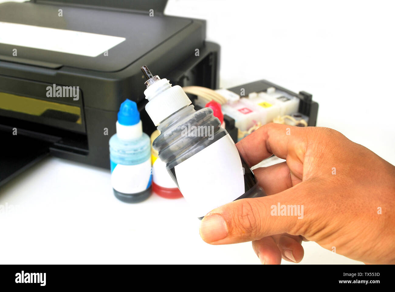 Four color printer on white background Stock Photo - Alamy