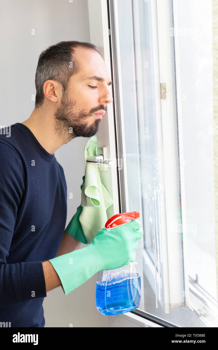 A man cleaning a window Stock Photo - Alamy