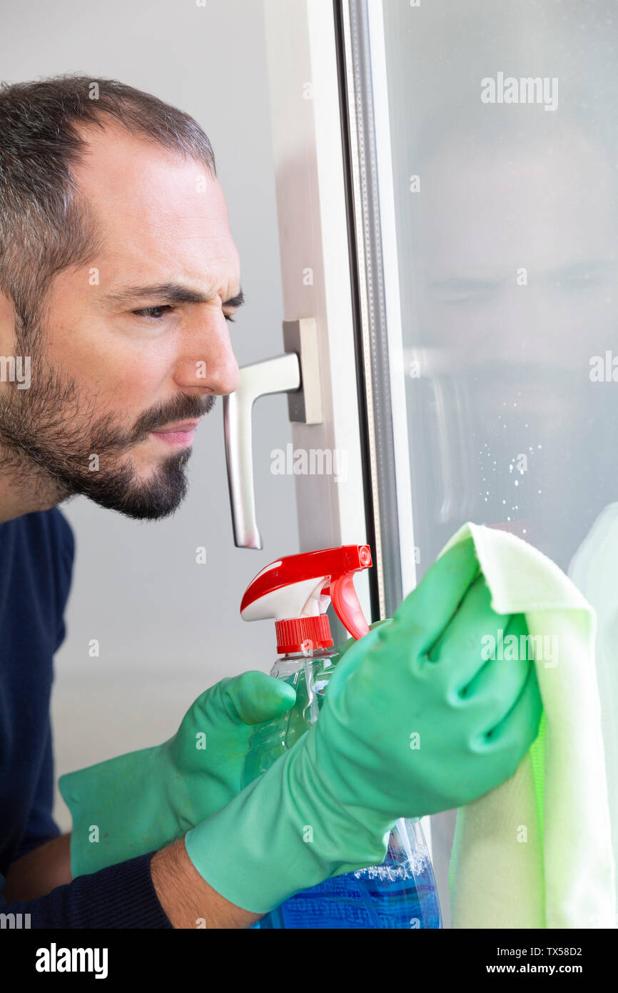 A man cleaning a window Stock Photo - Alamy