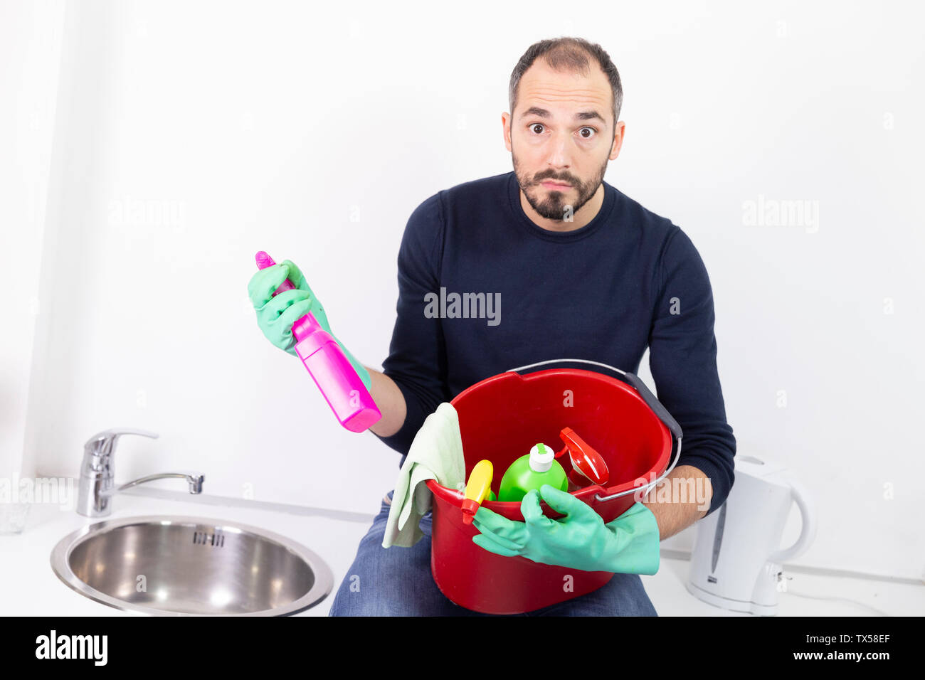 A man with cleaning products Stock Photo - Alamy