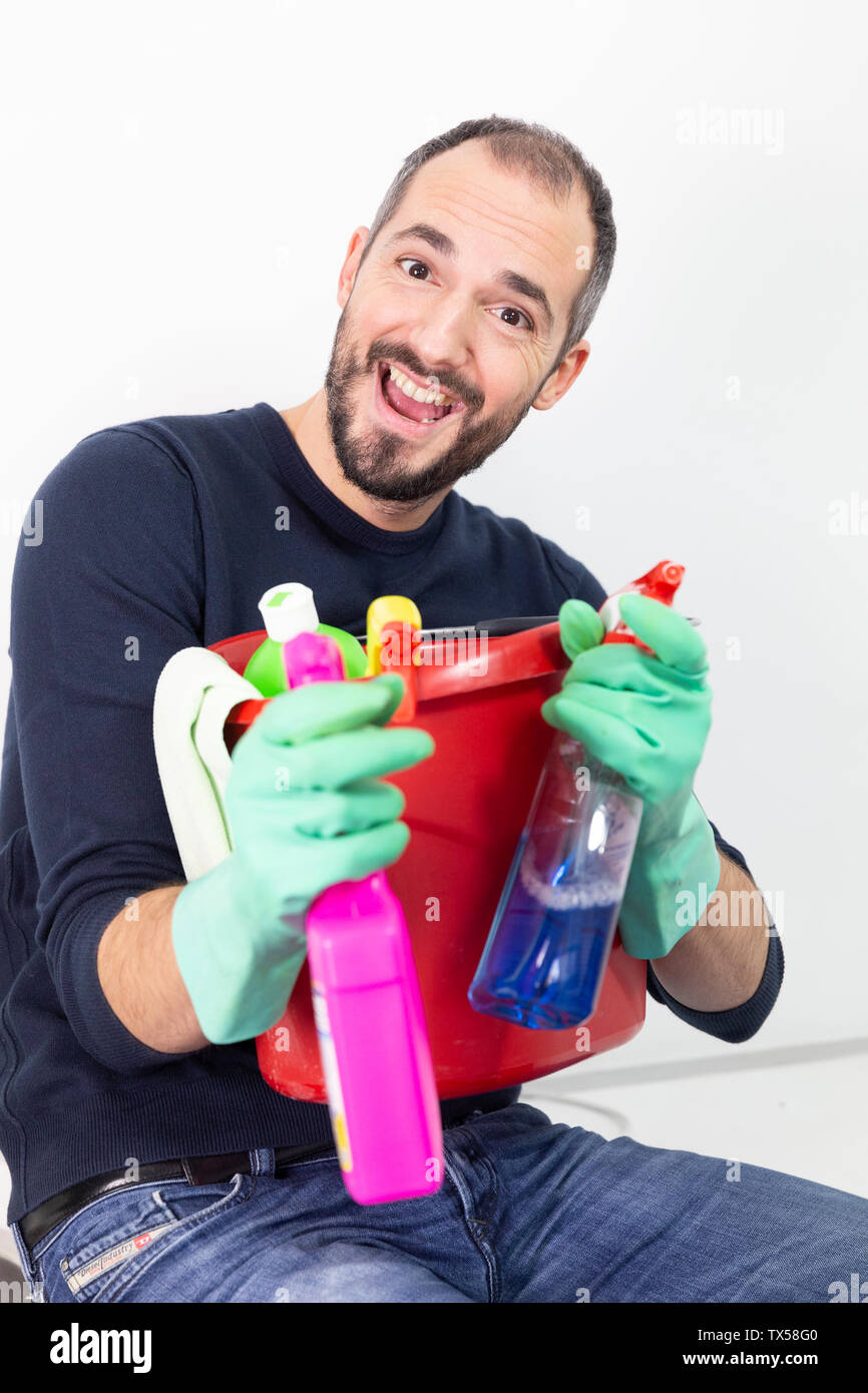 A man with cleaning products Stock Photo - Alamy