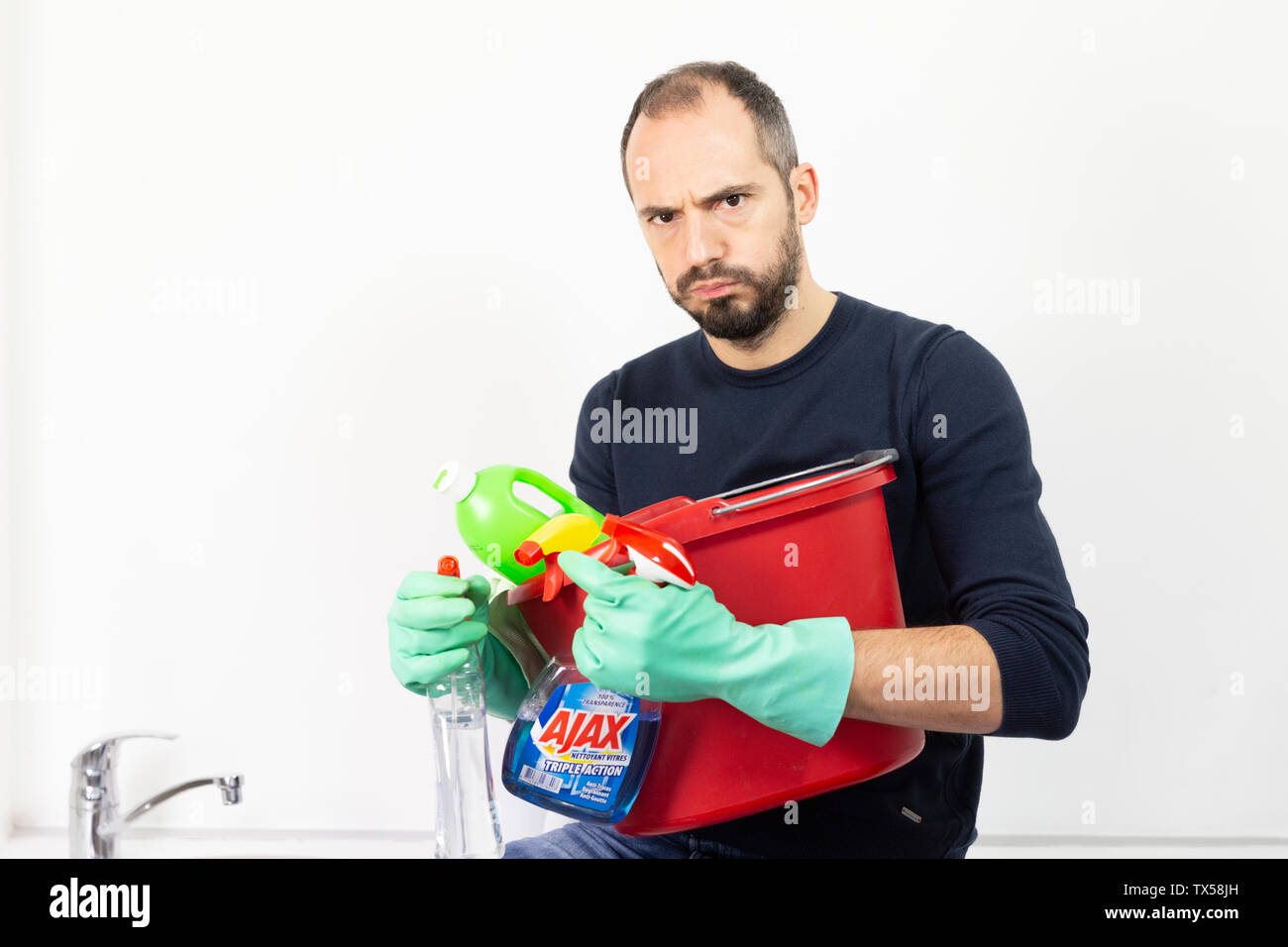 A man with cleaning products Stock Photo - Alamy