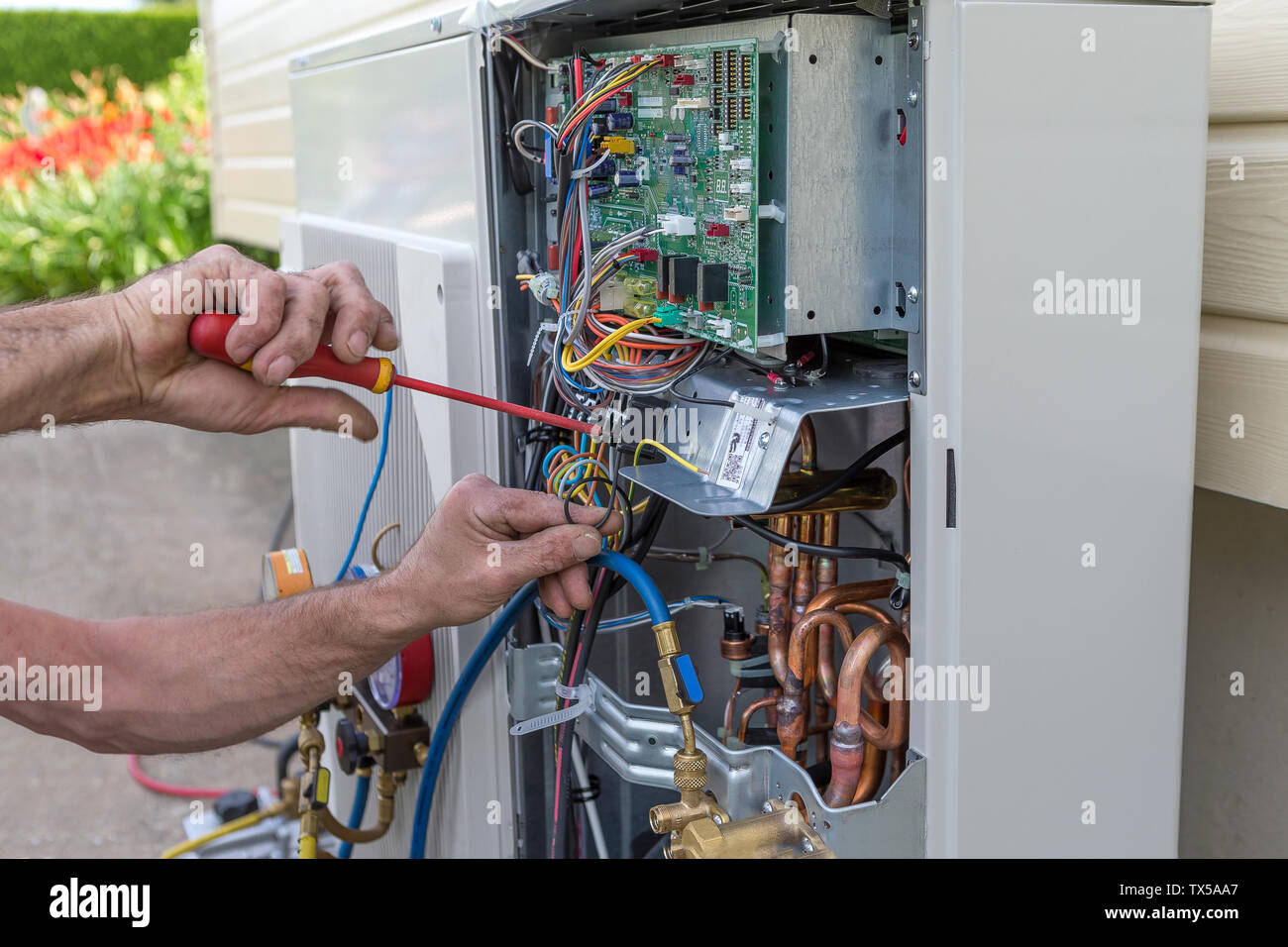 Heat Pump. plumber at work installing a circulation pump Stock Photo ...