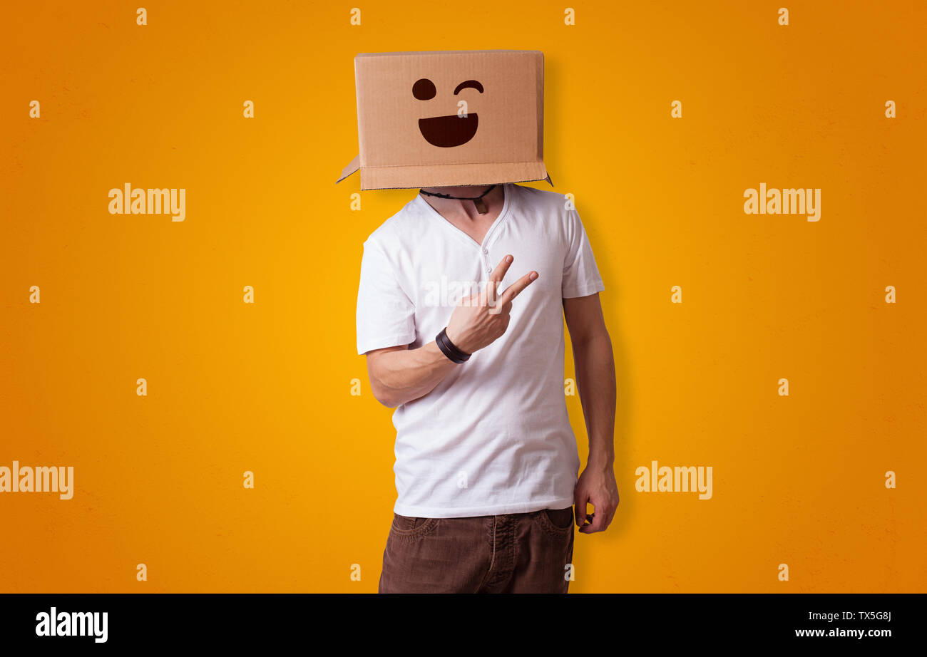 Funny man wearing cardboard box on his head with smiley face Stock ...
