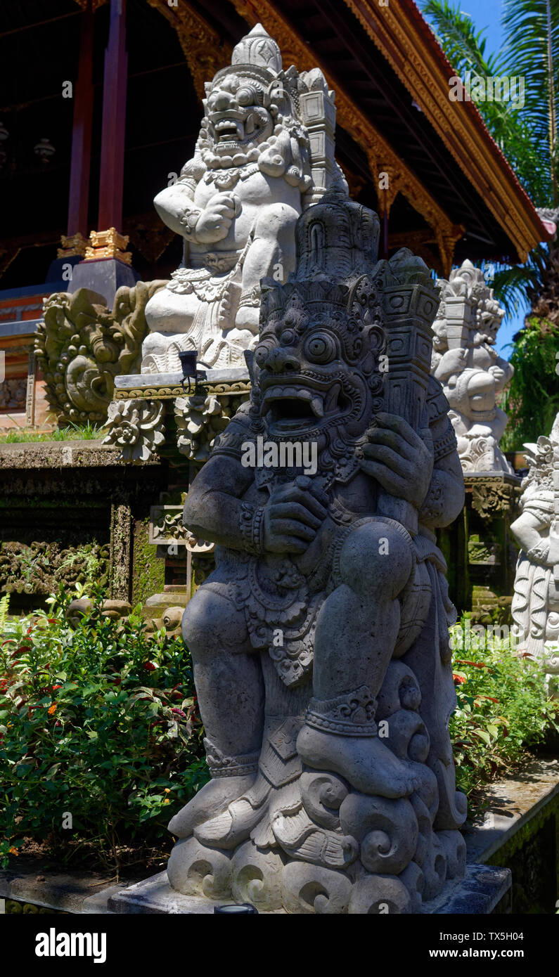 Carved stone demons as protection for property in Ubud, Bali, Indonesia ...