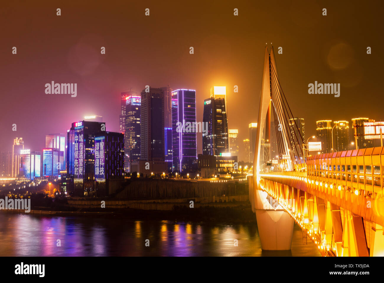 Night view of Chongqing riverfront in rain and fog Stock Photo - Alamy