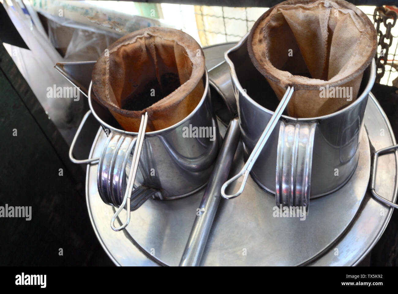 Stainless steel coffee jug and antique coffee bags Stock Photo - Alamy