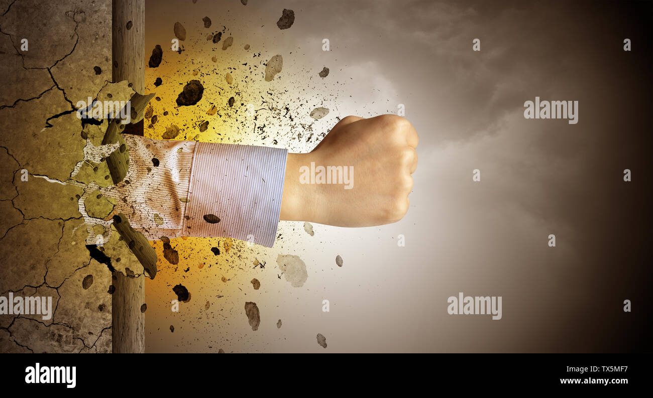 Big hand hits intense and breaks a crass stonewall Stock Photo - Alamy