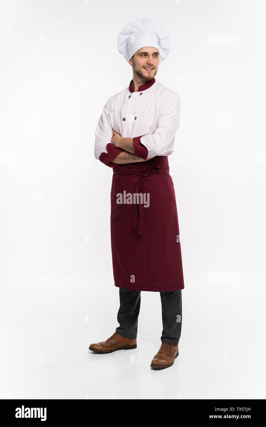 Full length portrait of positive handsome chef cook in beret and white ...