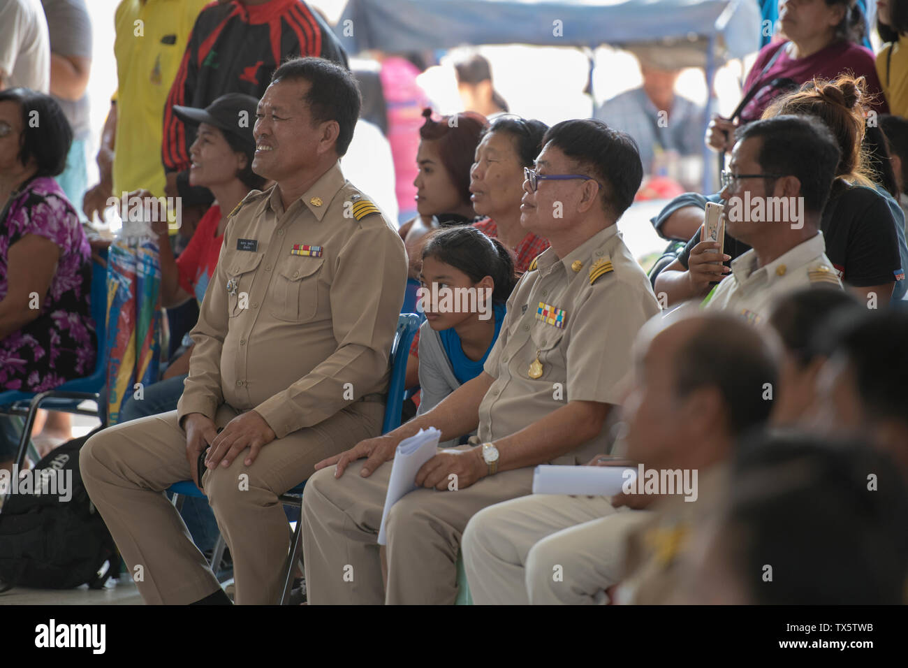 Line of people watching Thai conscription service Stock Photo - Alamy