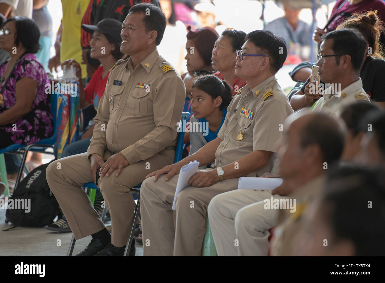 Line of people watching Thai conscription service Stock Photo - Alamy