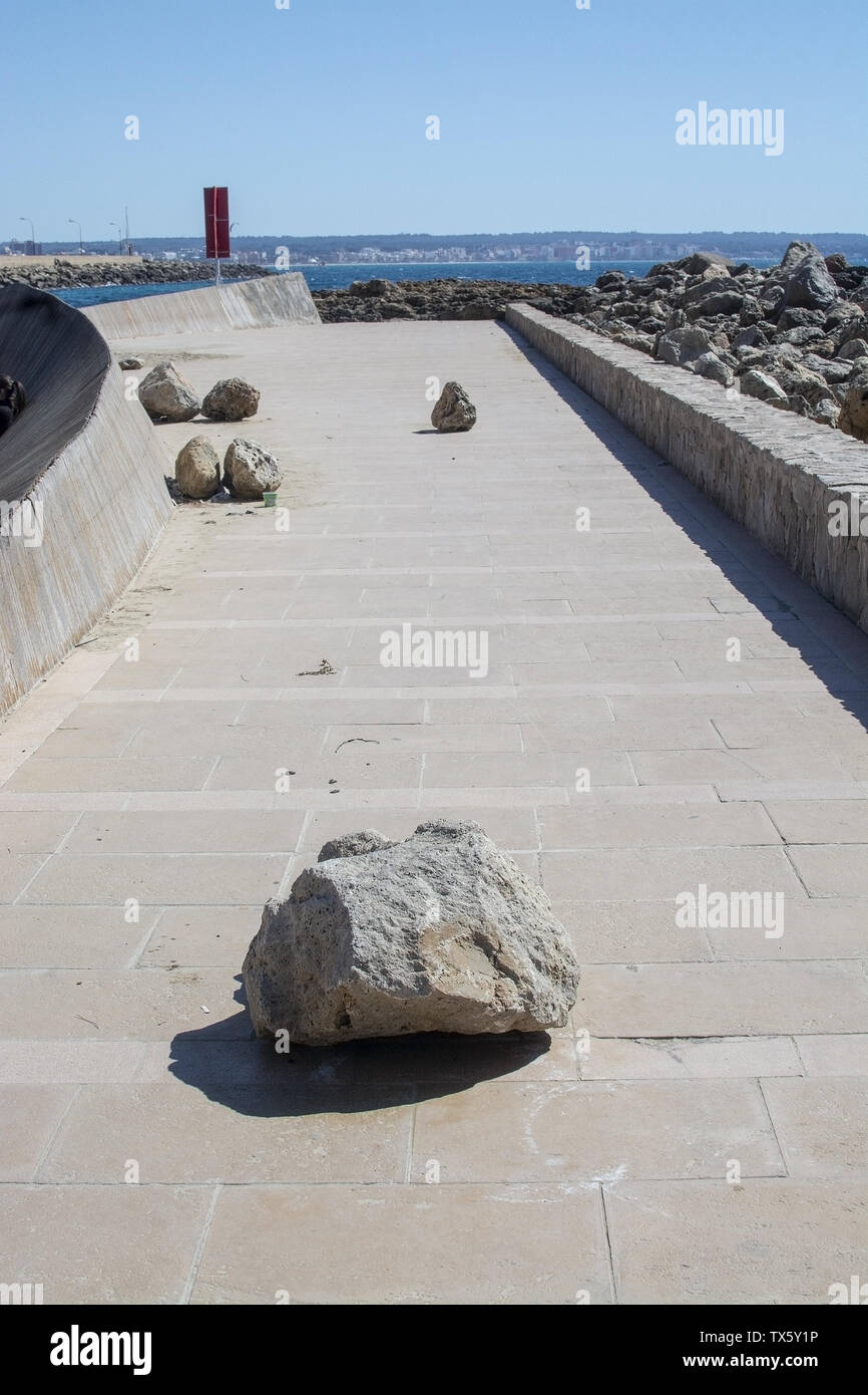 Large rocks thrown up on walkway seaside after winter storm in Can ...