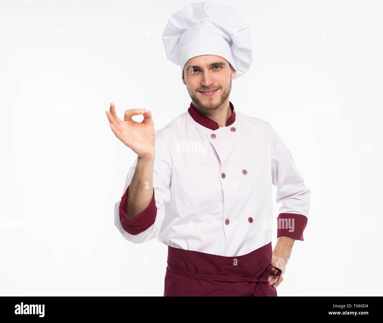 Positive professional happy man chef showing tasty ok sign isolated on ...