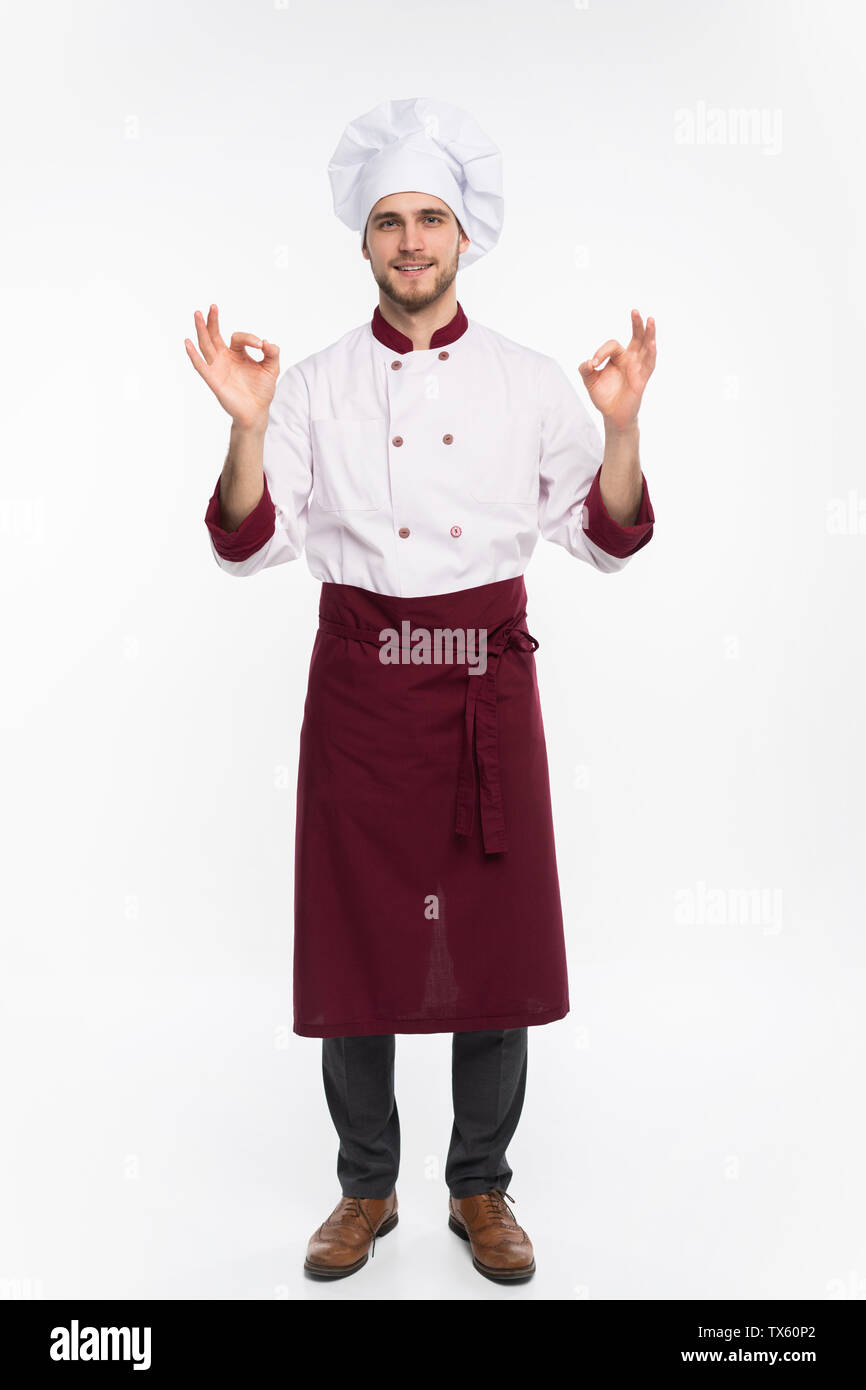 Positive professional happy man chef showing tasty ok sign isolated on ...