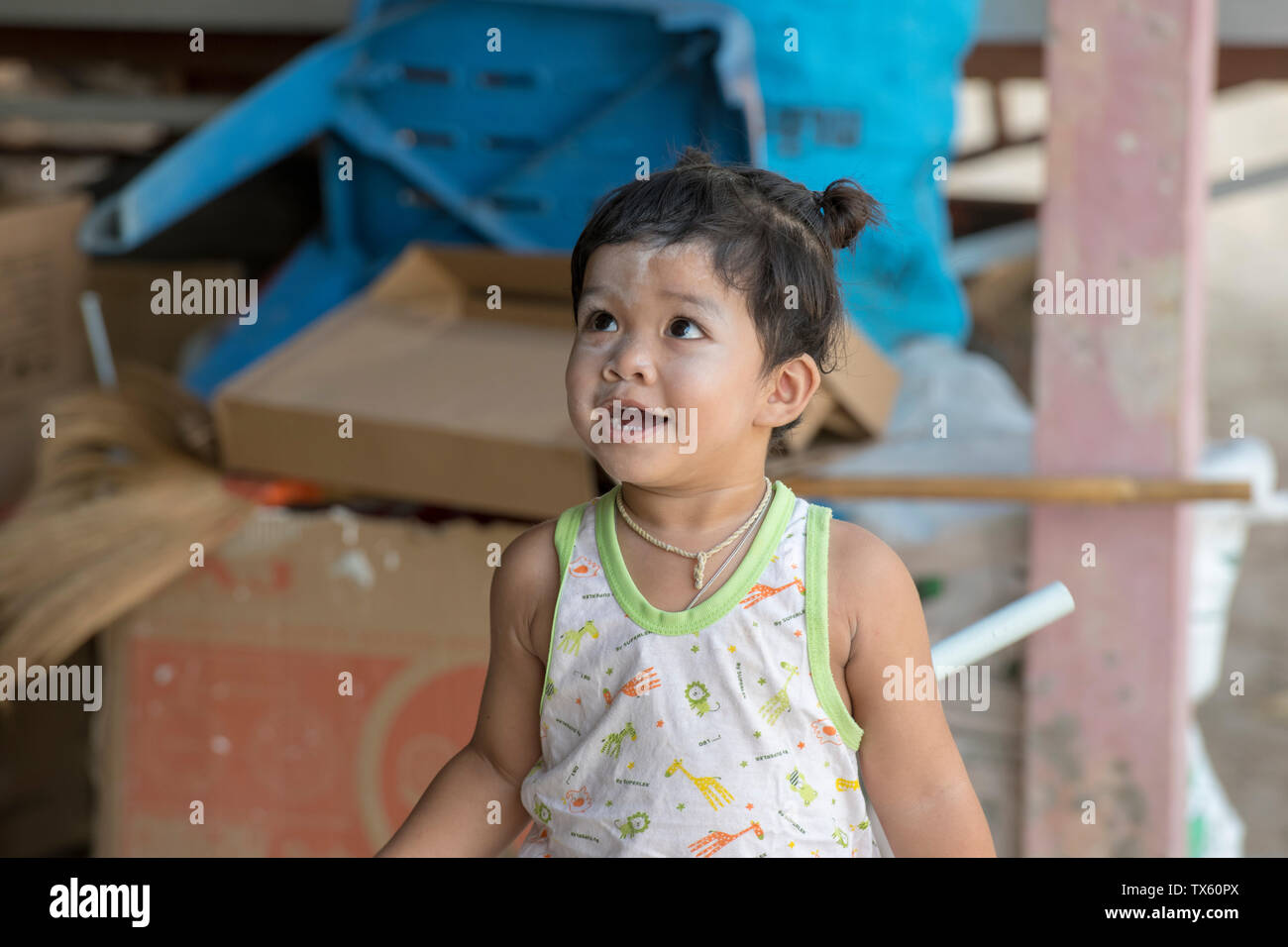 Young girl with cheeky smile Stock Photo - Alamy