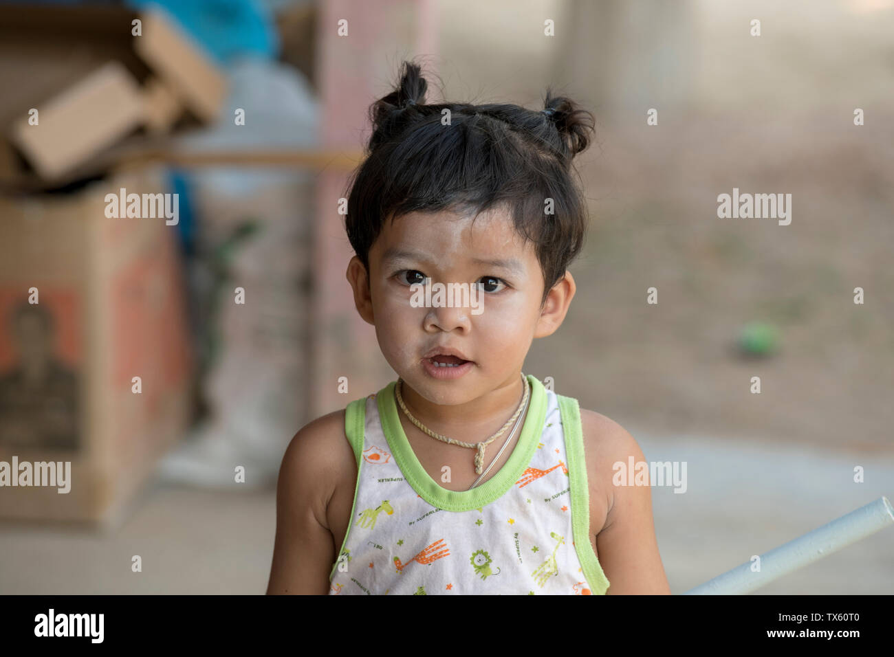 Young girl with cheeky smile Stock Photo - Alamy