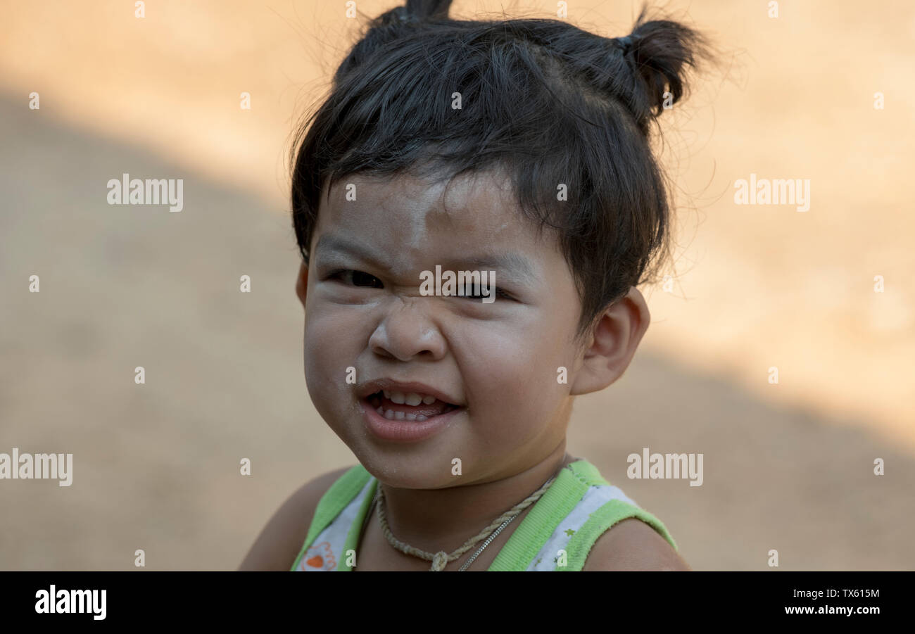 Young girl with cheeky smile Stock Photo - Alamy