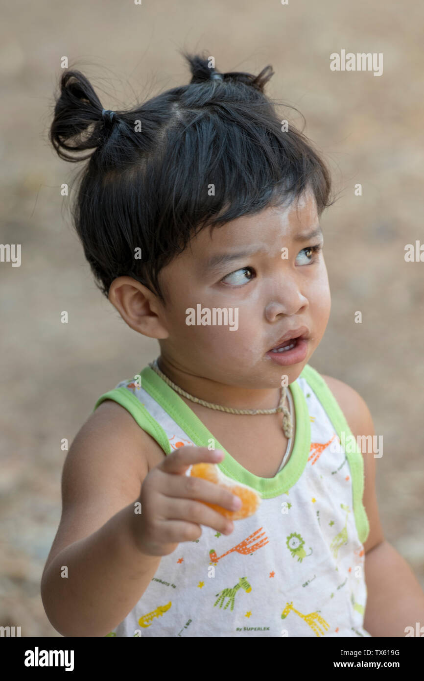Young girl with cheeky smile Stock Photo - Alamy