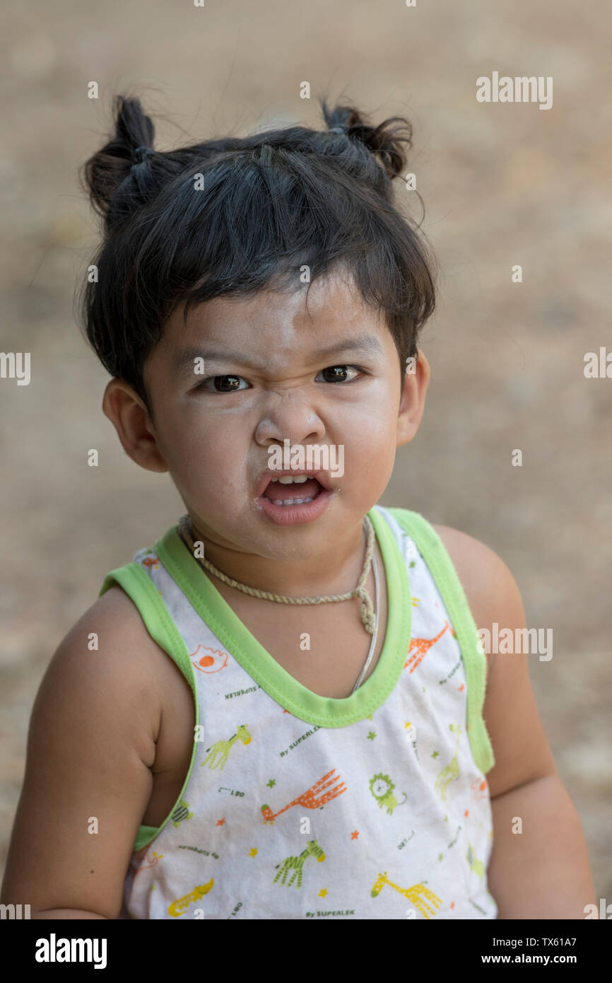 Young girl with cheeky smile Stock Photo - Alamy