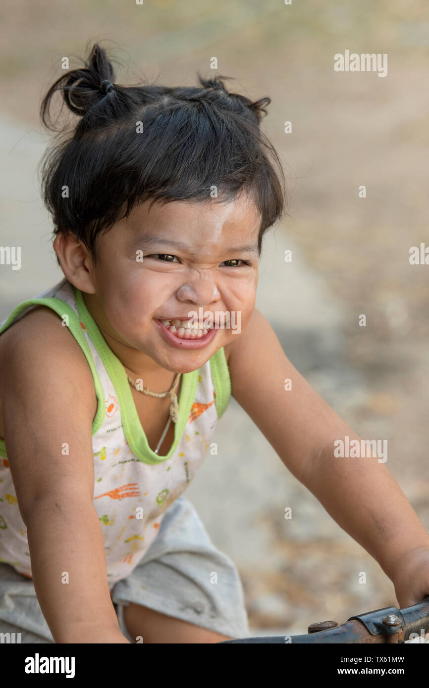 Young girl with cheeky smile Stock Photo - Alamy