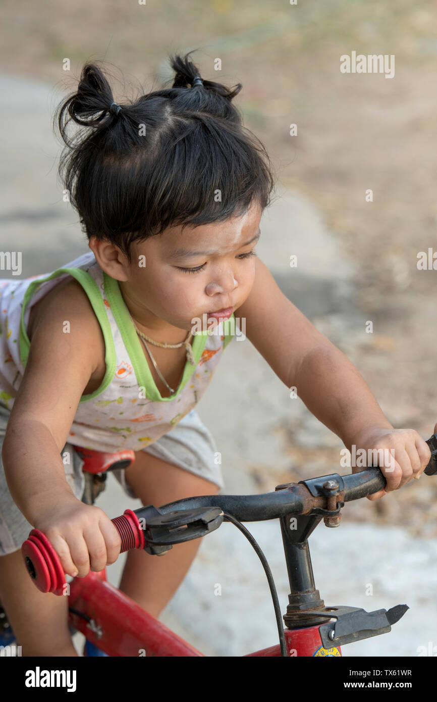 Young girl with cheeky smile Stock Photo - Alamy