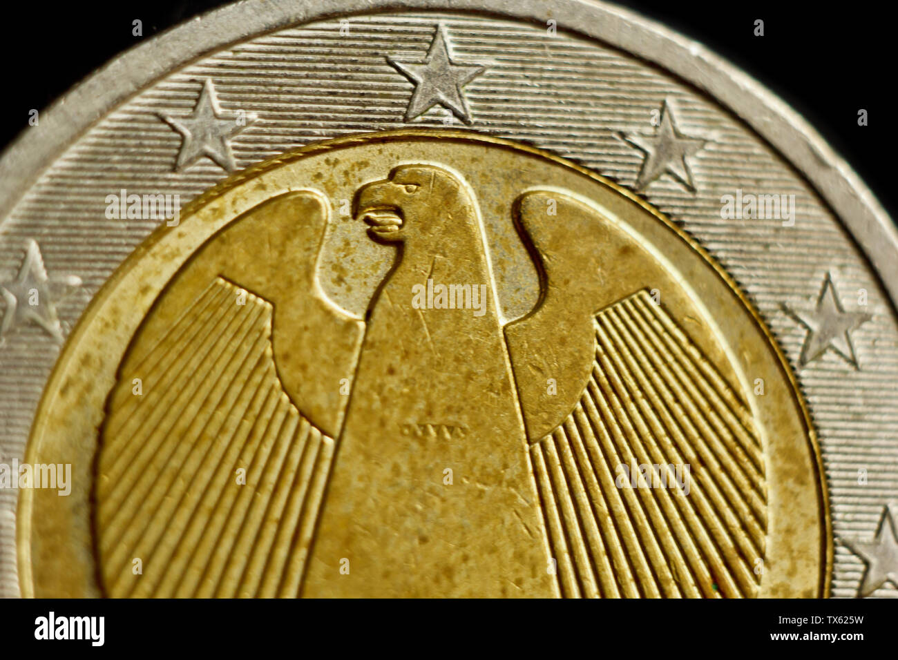 Reverse side of a coin two euro close-up isolated on black background ...