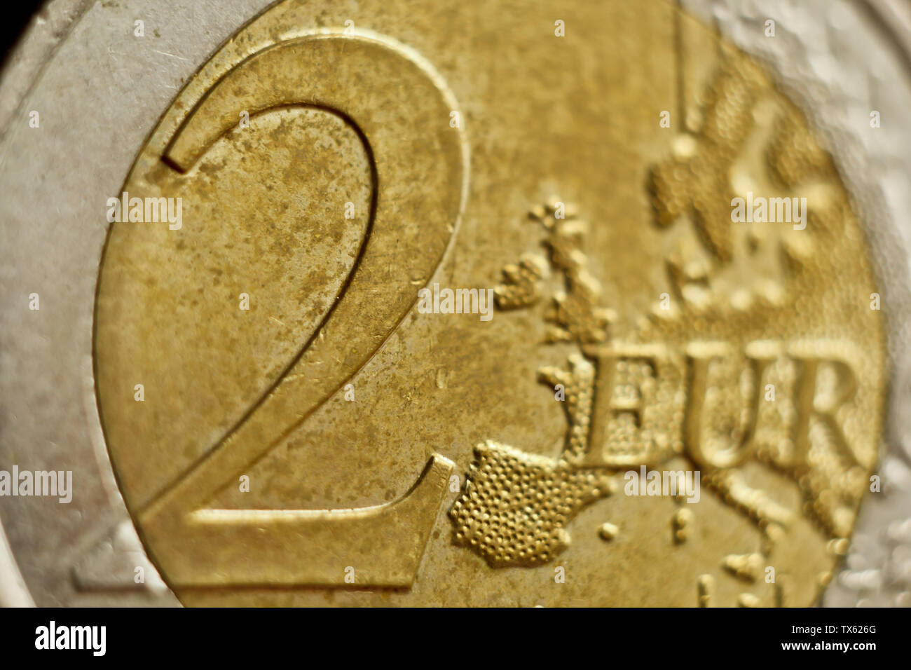 two euro coin close up isolated on black background. Detail of metallic ...