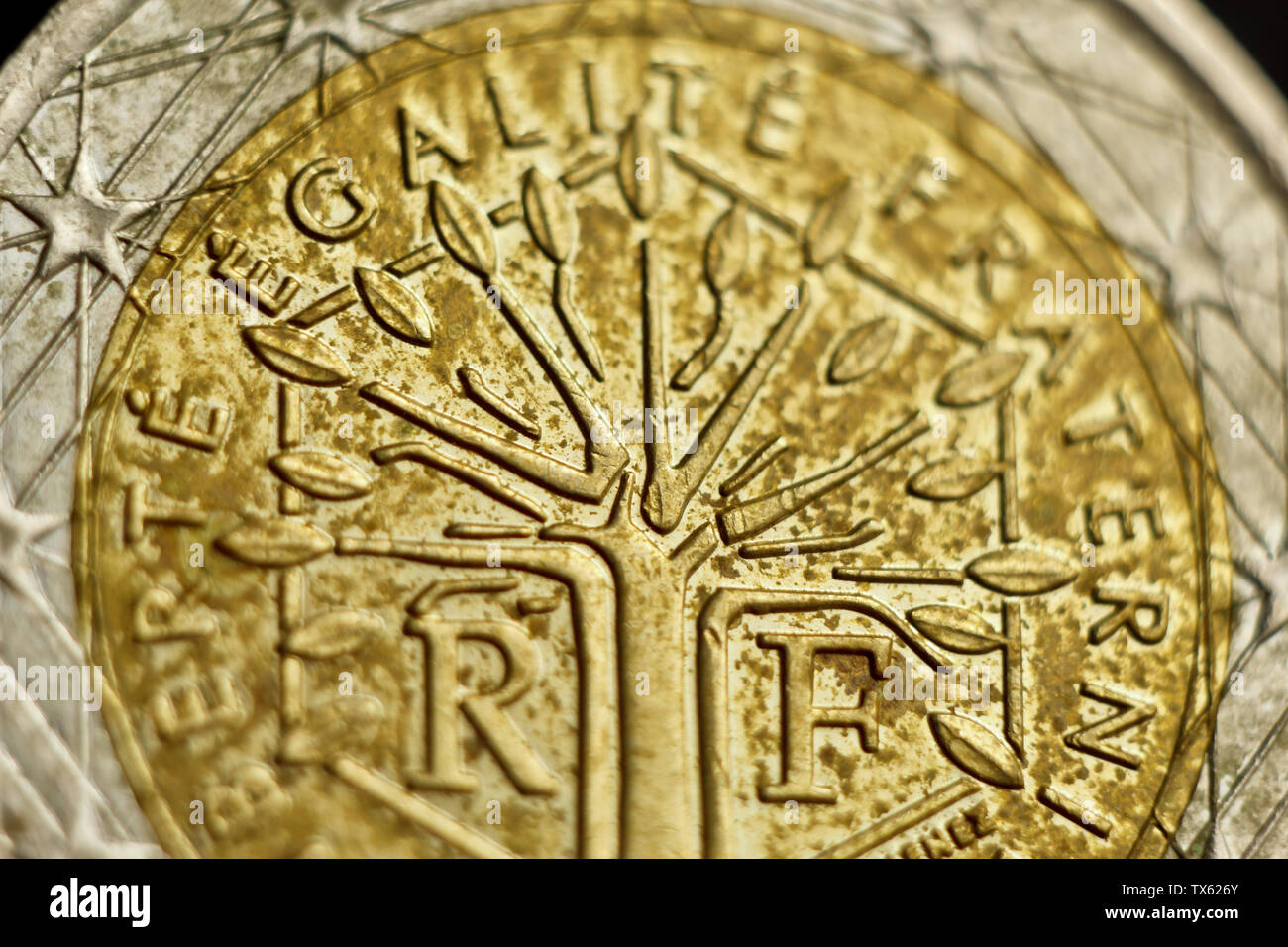 Reverse side of a coin two euro close-up isolated on black background ...