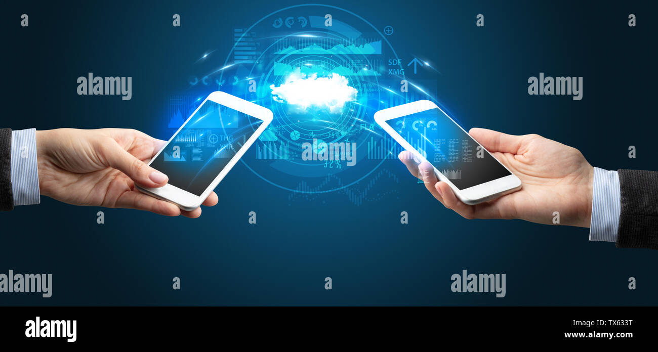 Two mobile phones syncing through the cloud Stock Photo - Alamy