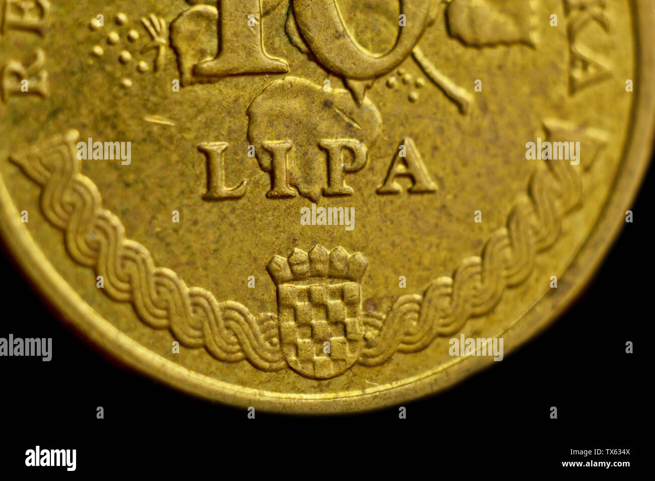 Coin ten Croatian lipa macro isolated on black background. Detail of ...