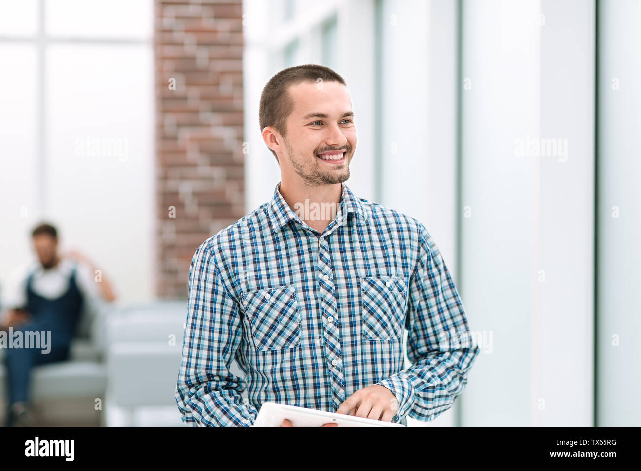 modern man standing near the office window .photo with copy space Stock ...