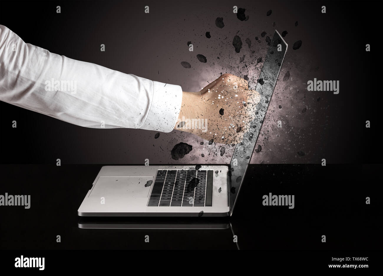 Strong male hand breaks laptop screen glasses Stock Photo - Alamy