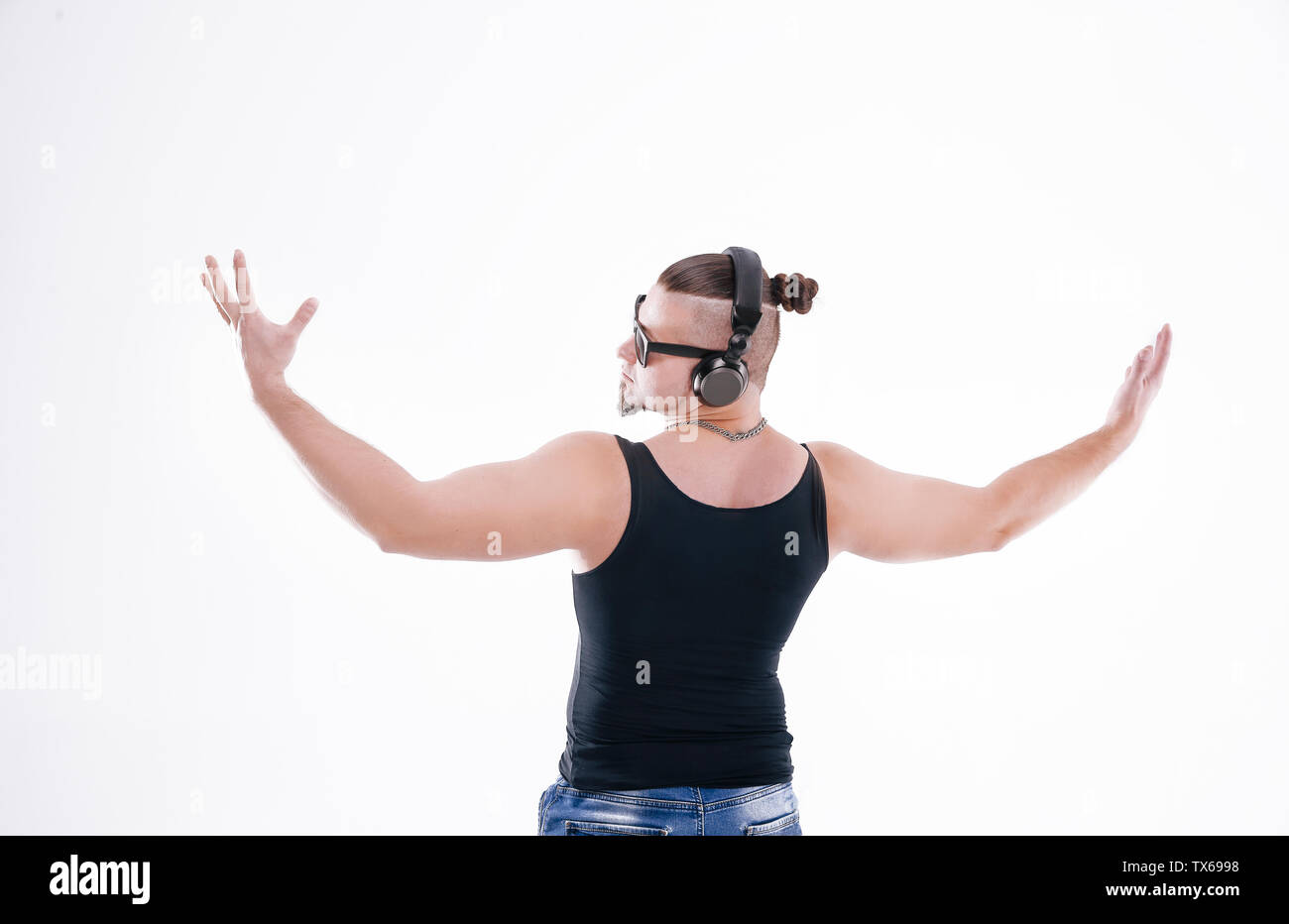 rear view.stylish DJ-rapper, looking at copy space.isolated on white ...