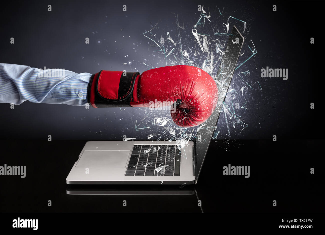 Hand hitting strongly laptop screen glass Stock Photo - Alamy