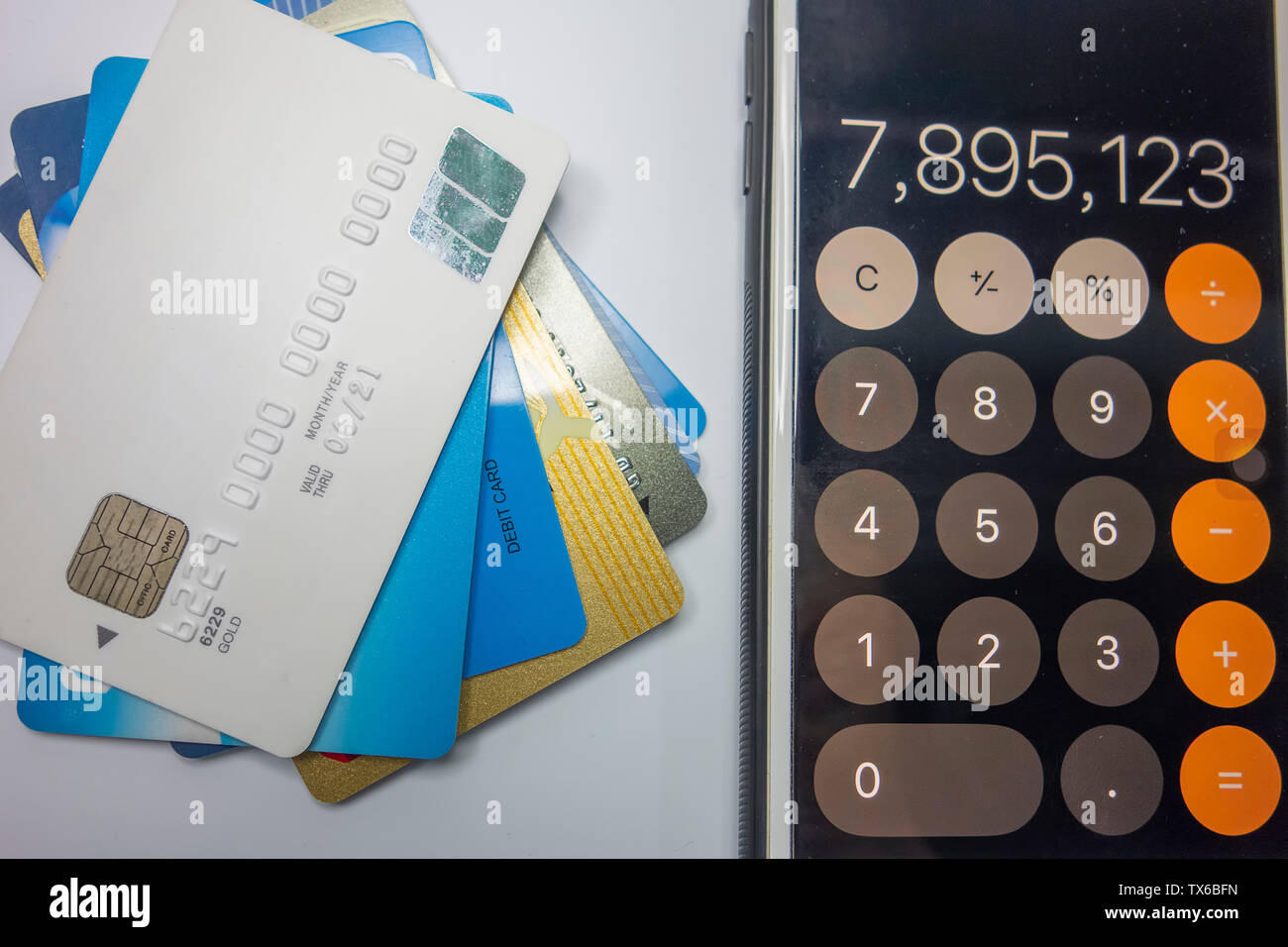 Multiple bank cards and calculators Stock Photo - Alamy
