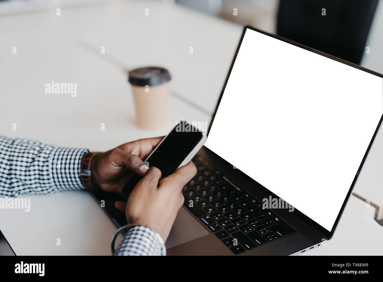 close up hand using phone white screen on work space table Stock Photo ...