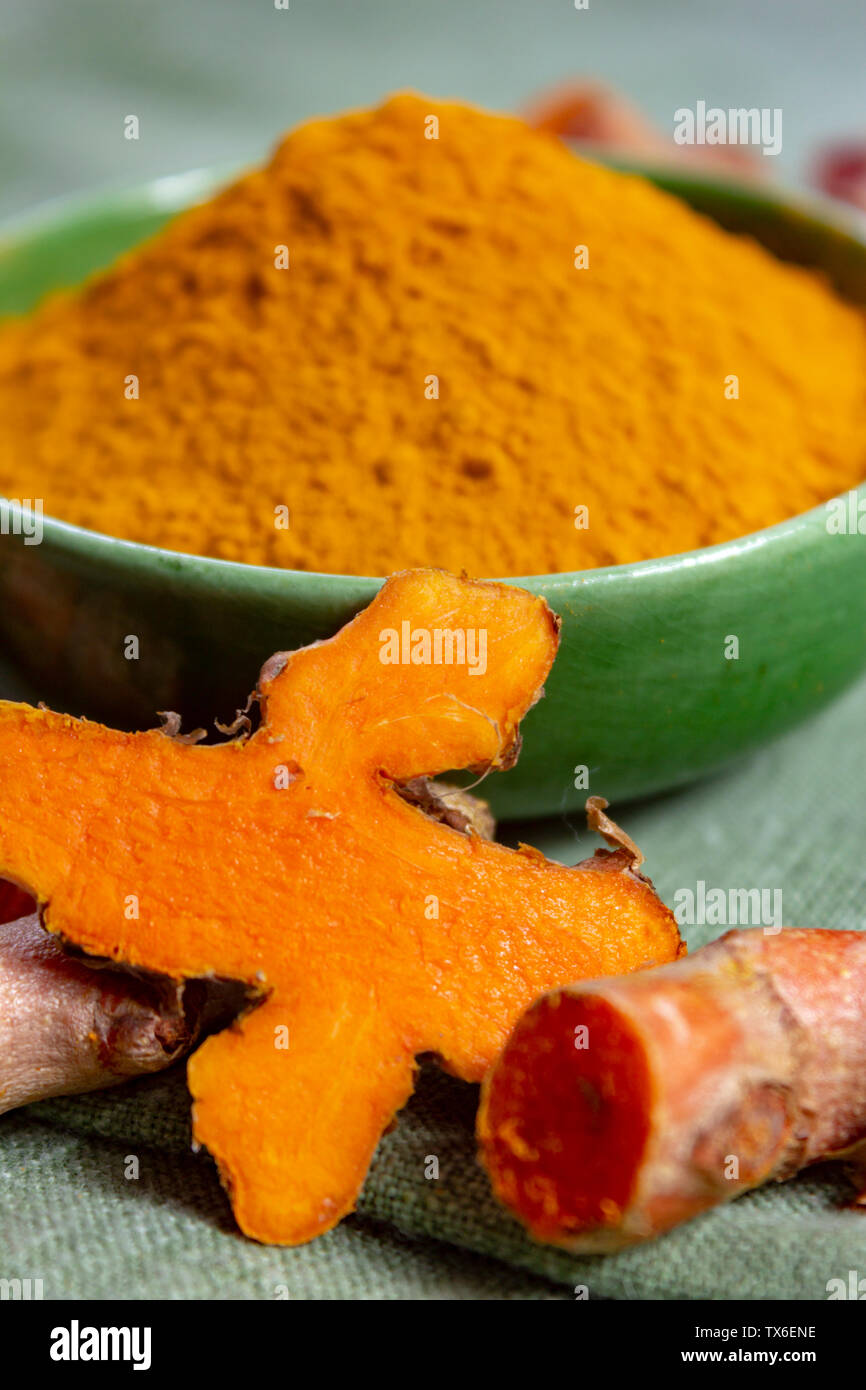 Fresh turmeric or curcuma root and dried powder, wildly used in Asia ...