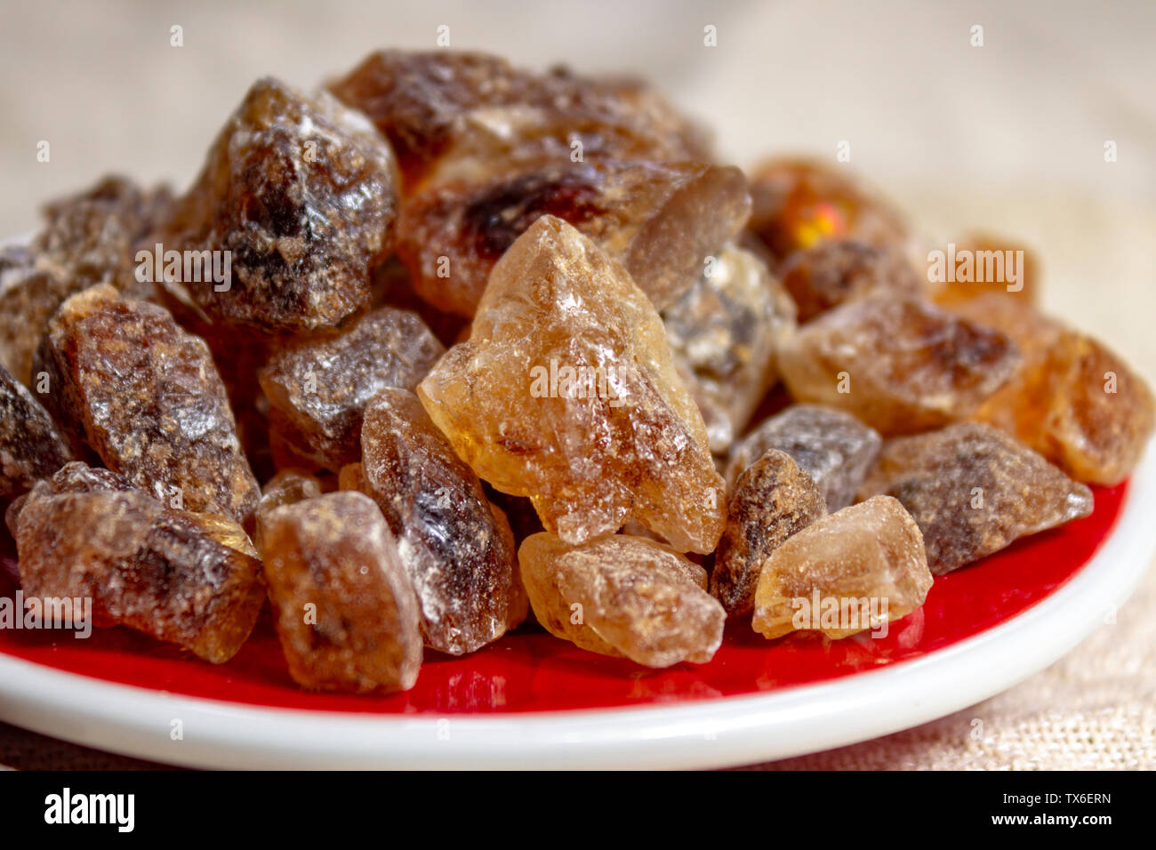 Crystals of candy sugar, traditional brown rock sugar originally from ...
