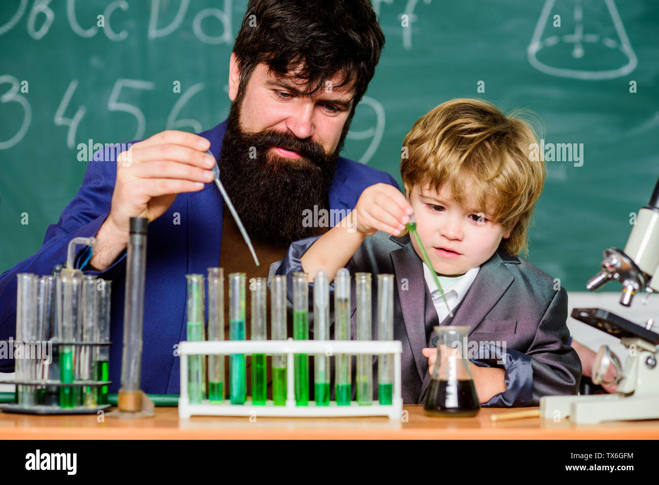 father and son at school. biotechnoloy research concept. Back to school ...
