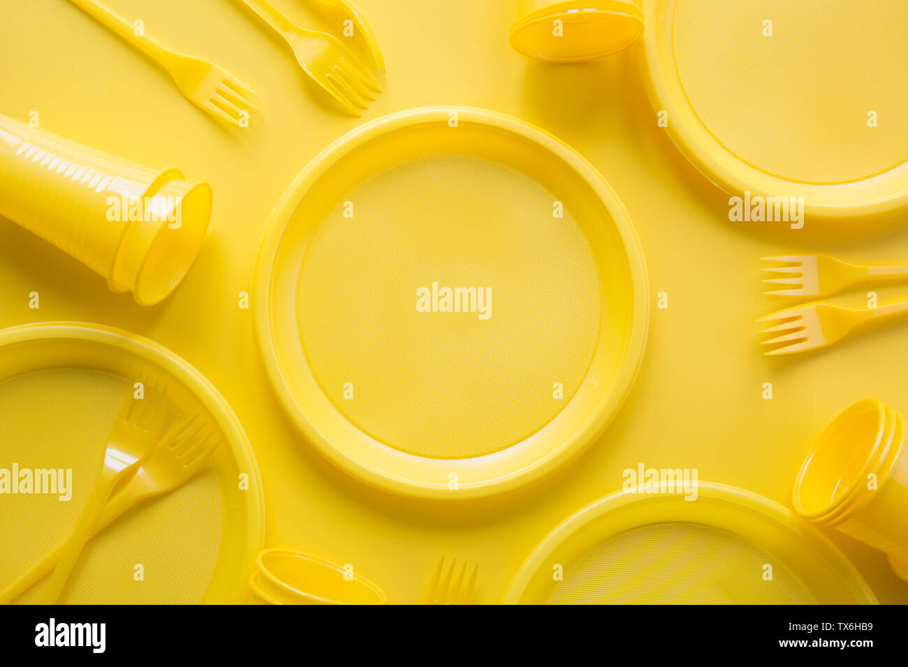 Yellow disposable picnic utensils. Environment , eco friendly discarded ...